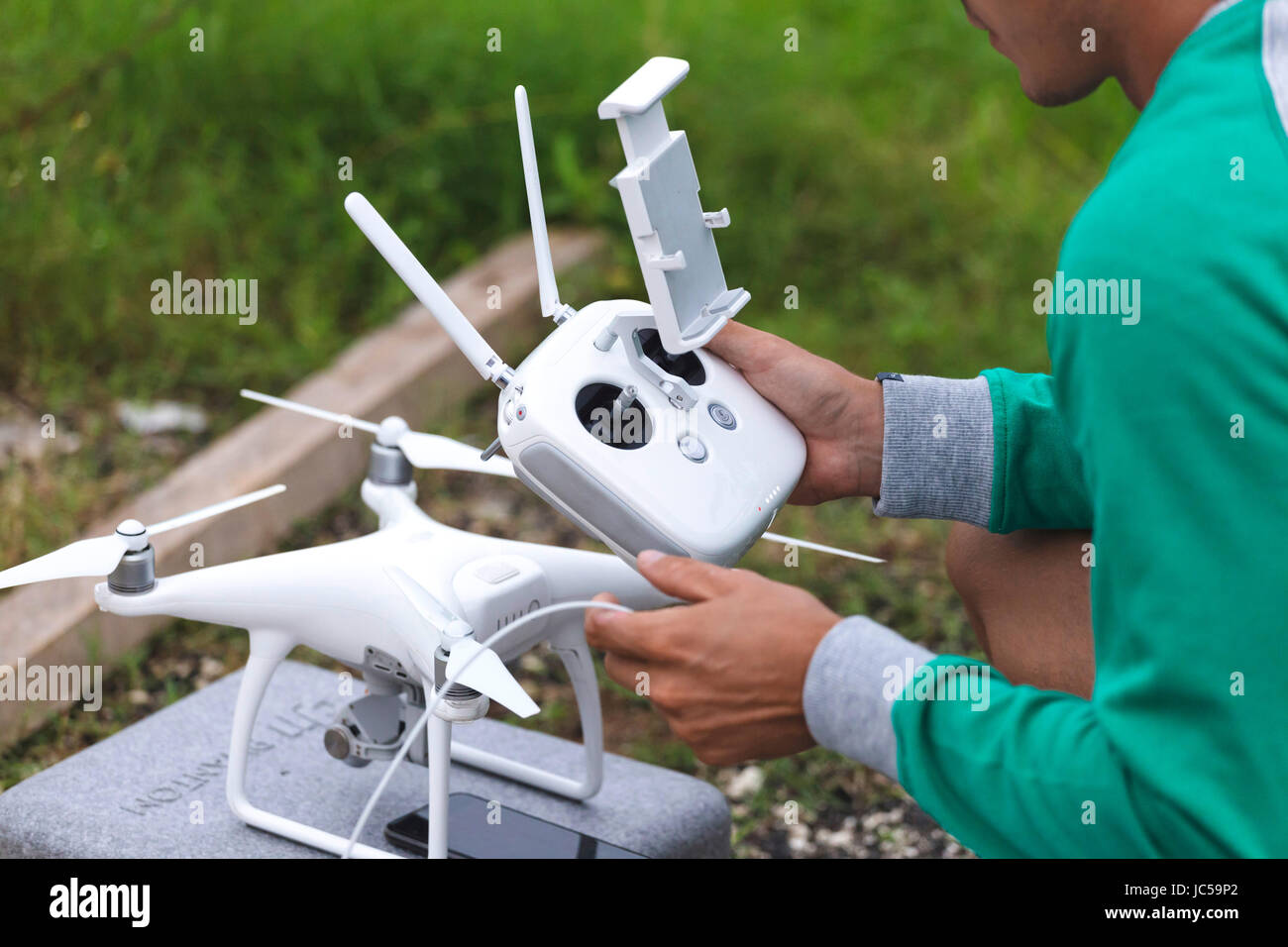 Man holding drone remote control Stock Photo - Alamy