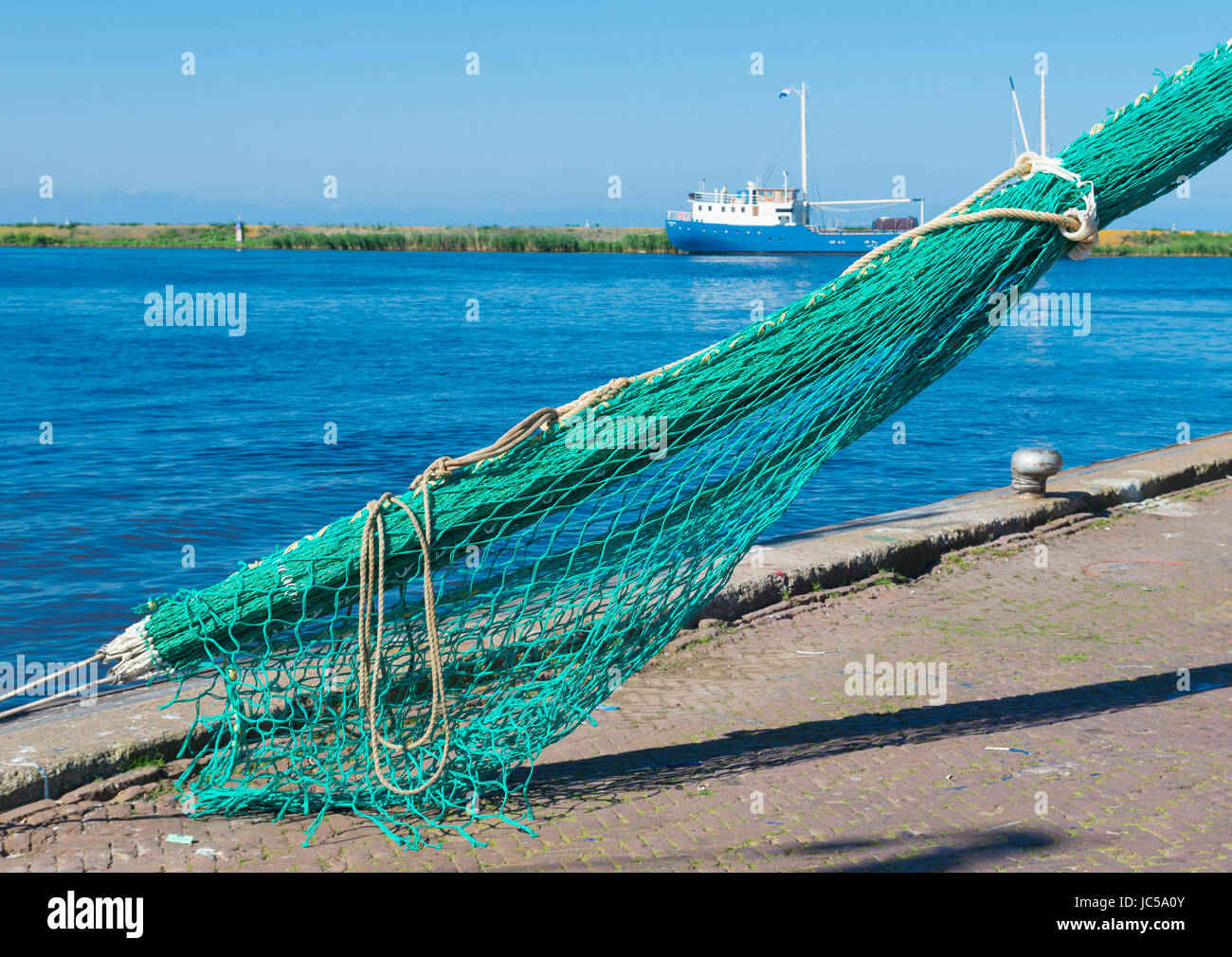 detail of a fishing net in a dutch harbor Stock Photo - Alamy