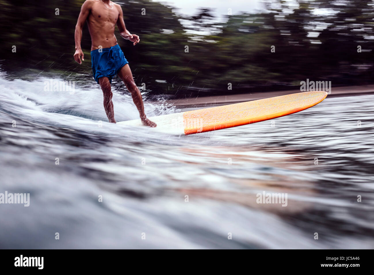 Male surfer on wave Stock Photo - Alamy