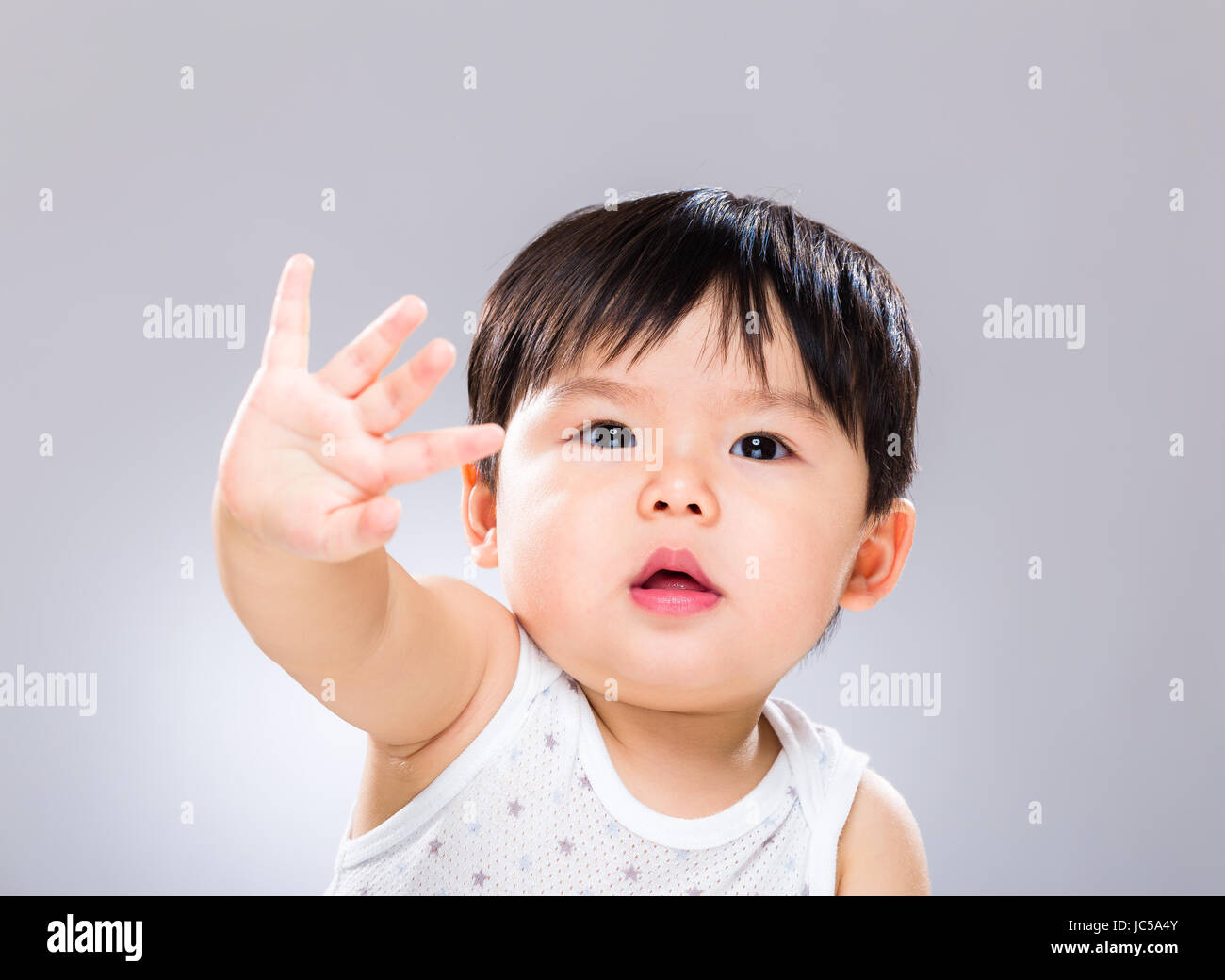 Baby boy hand reach something Stock Photo - Alamy
