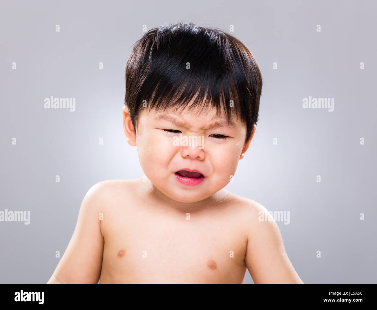 Baby boy crying Stock Photo - Alamy