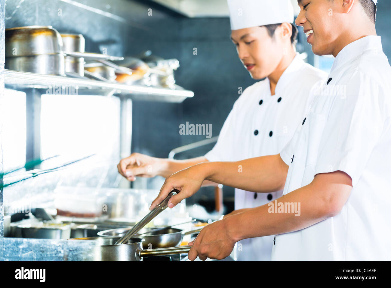 Portrait of young Asian chefs cooking in Restaurant Stock Photo - Alamy