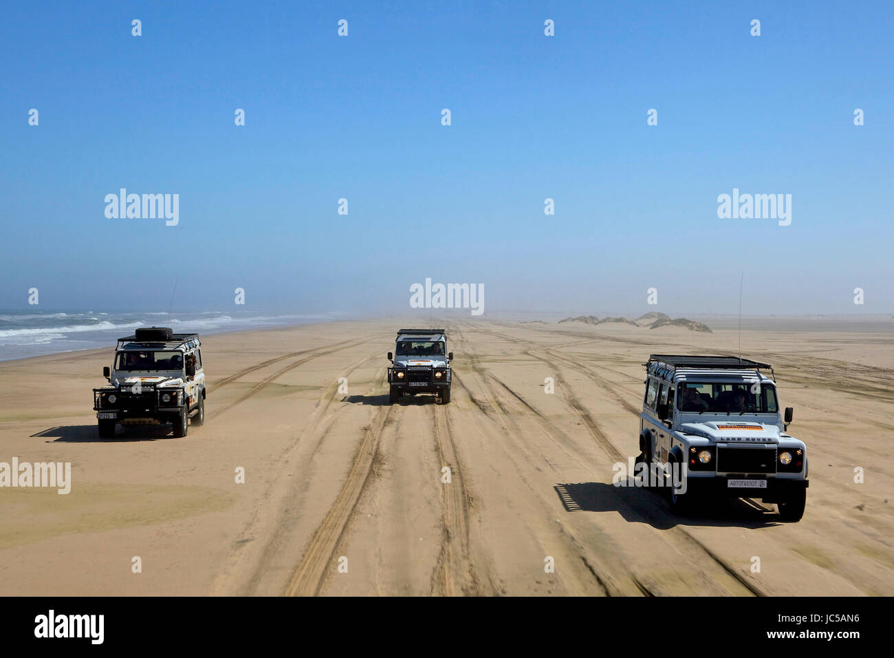Cars racing on beach Stock Photo - Alamy