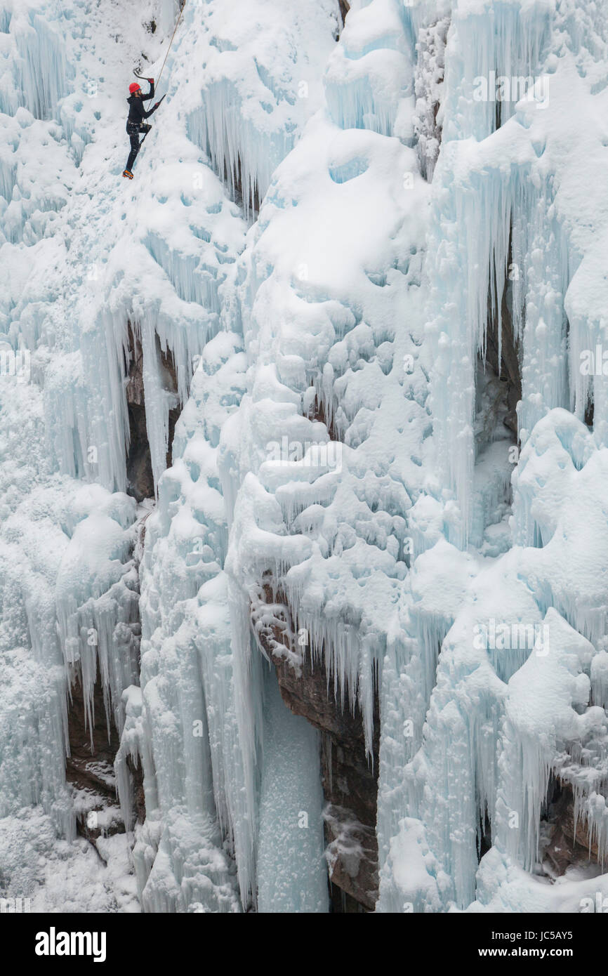 An ice climber follows a route in the Lead Area above the Upper Bridge ...