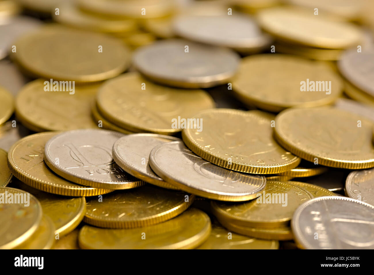 Pile of coins close up Stock Photo - Alamy