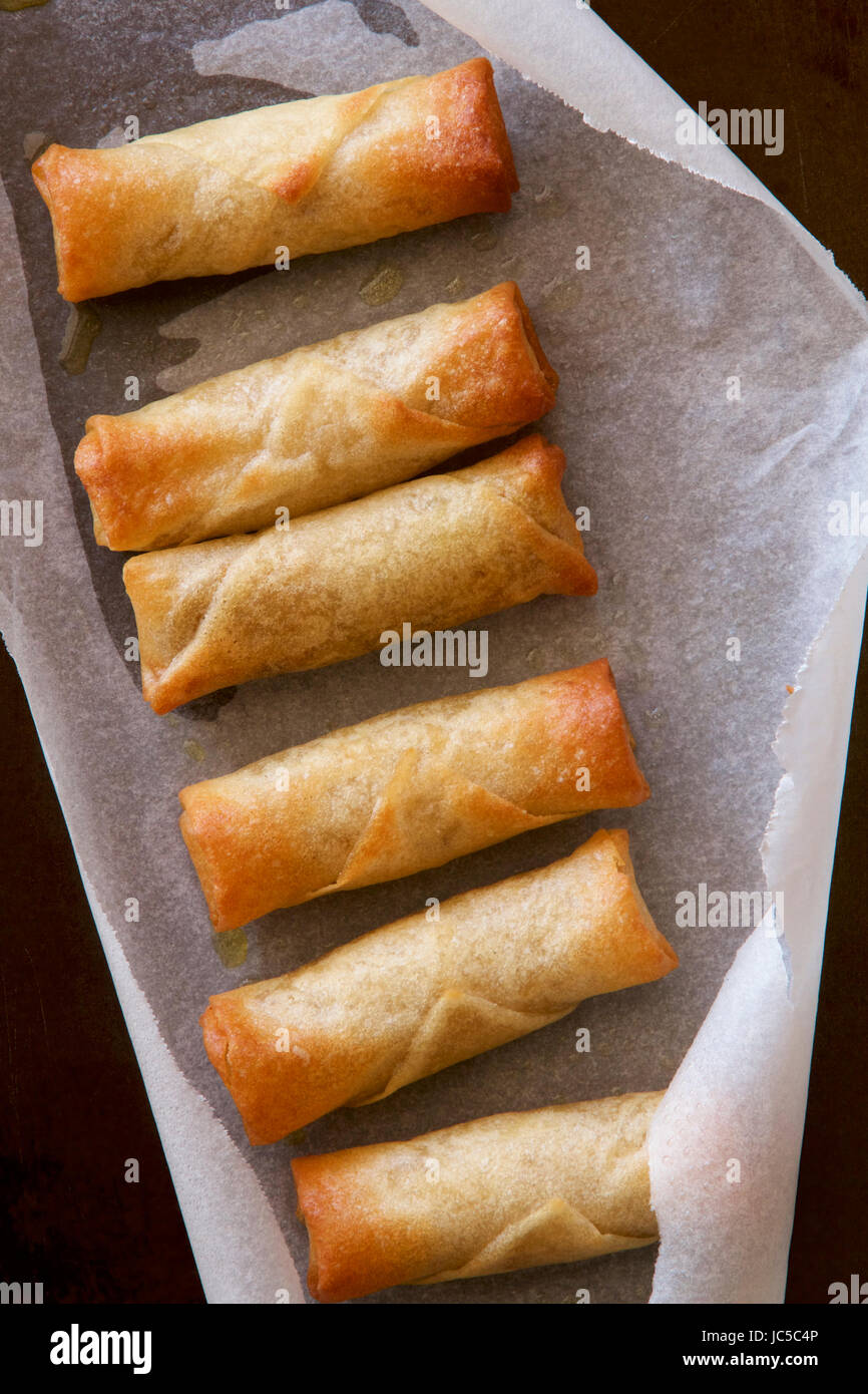 Cooked spring rolls fresh from the oven Stock Photo - Alamy