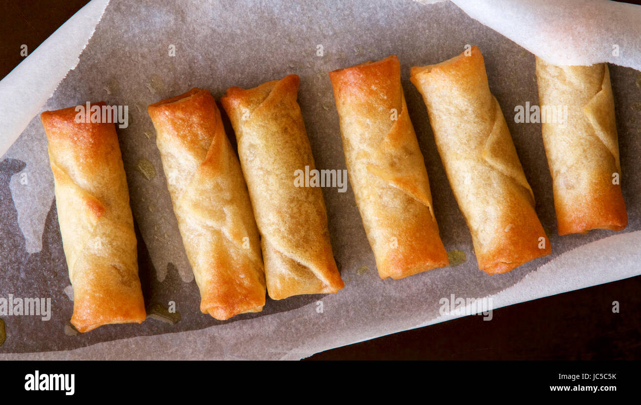Cooked spring rolls fresh from the oven Stock Photo - Alamy