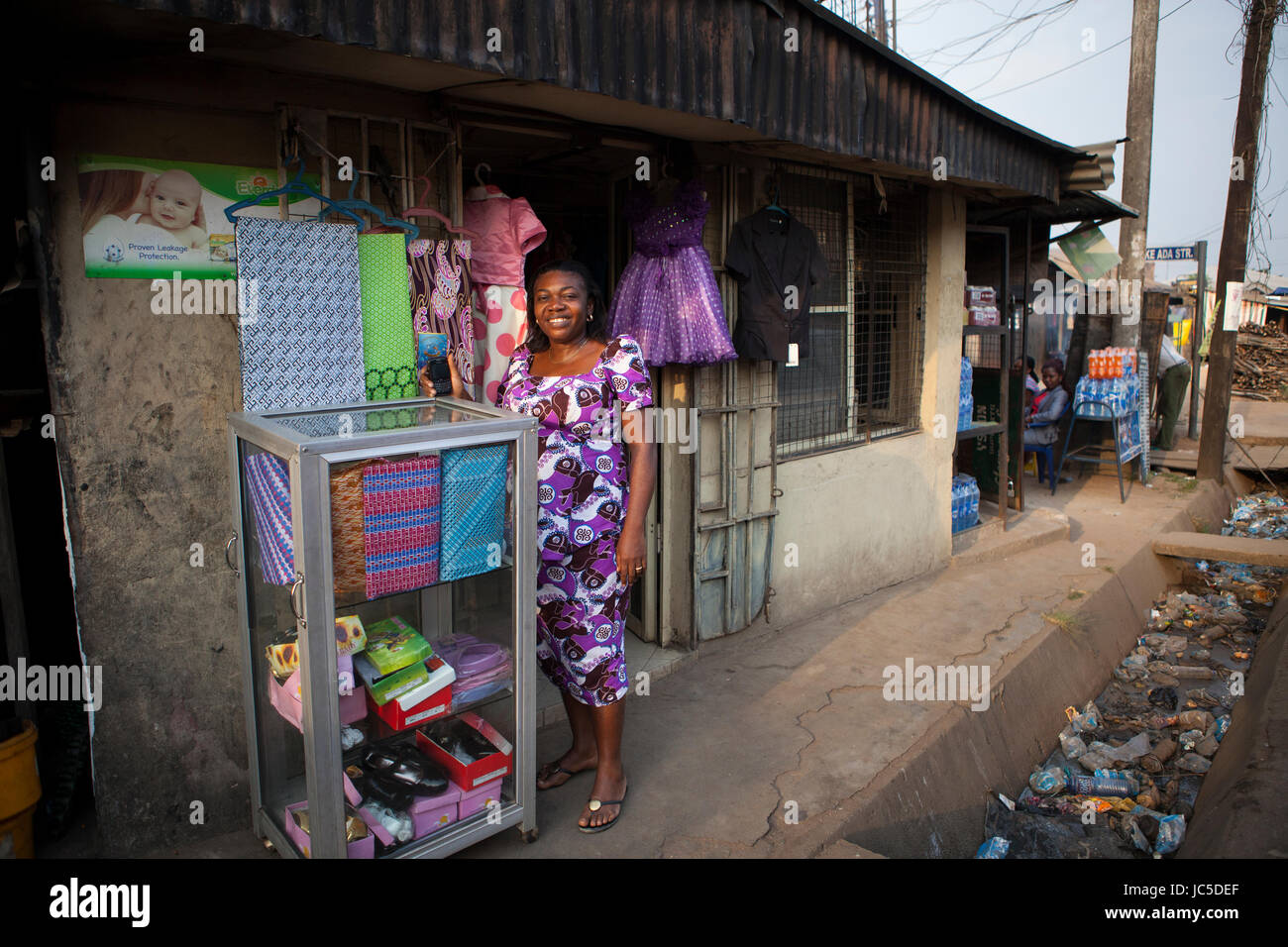 A female shop keeper, Nigeria, Africa Stock Photo - Alamy