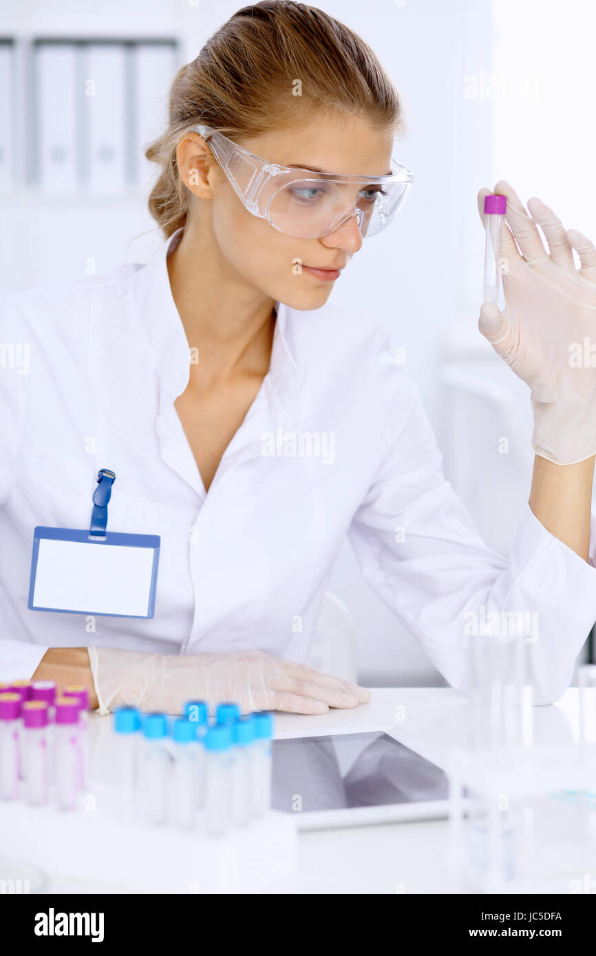 Female scientific researcher in laboratory Stock Photo - Alamy