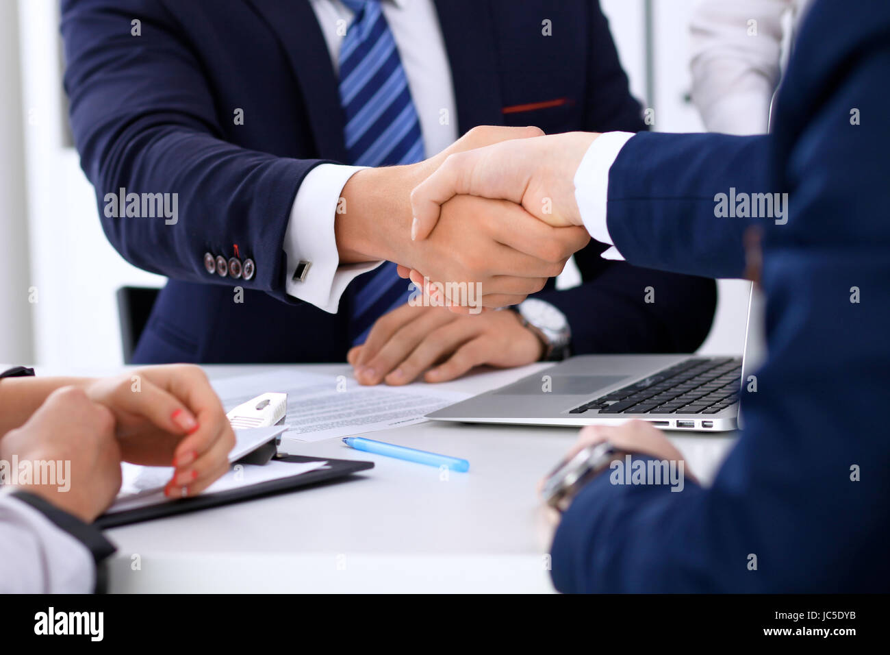 Business handshake at meeting or negotiation in the office. Partners ...