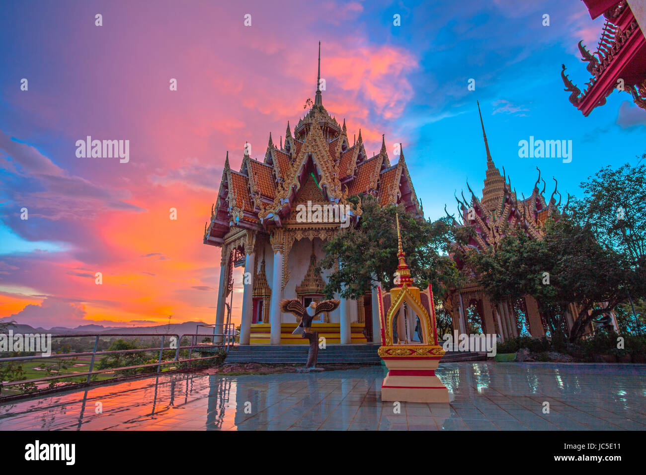 stunning scenery on Tiger cave temple in sunset time. a golden Buddha ...