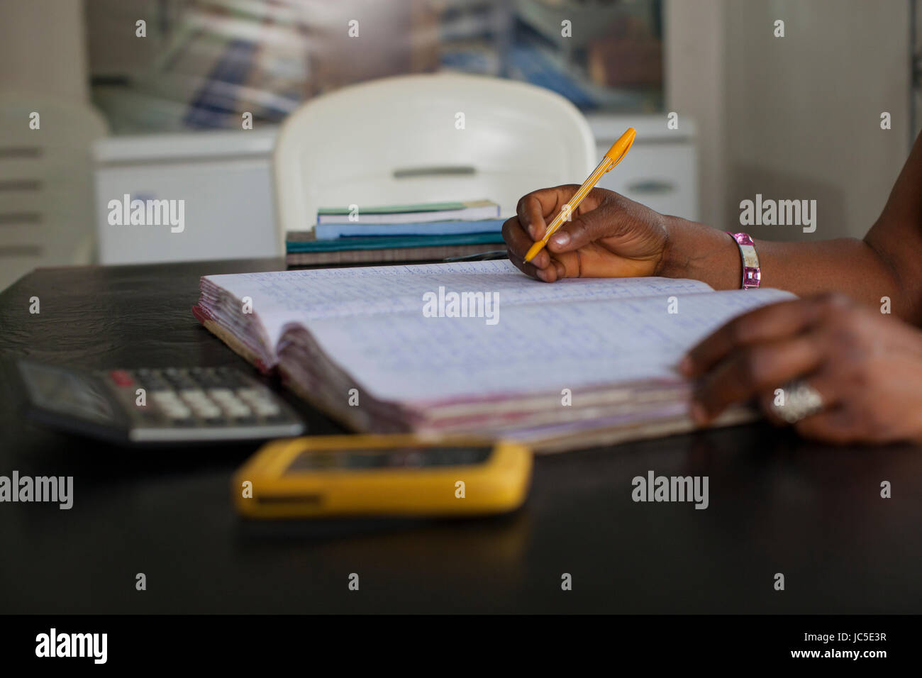 A business woman doing her book keeping, Nigeria, Africa Stock Photo ...