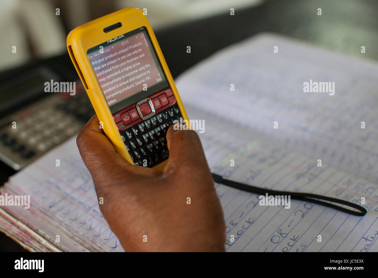 Woman using her mobile phone, Nigeria, Africa Stock Photo - Alamy