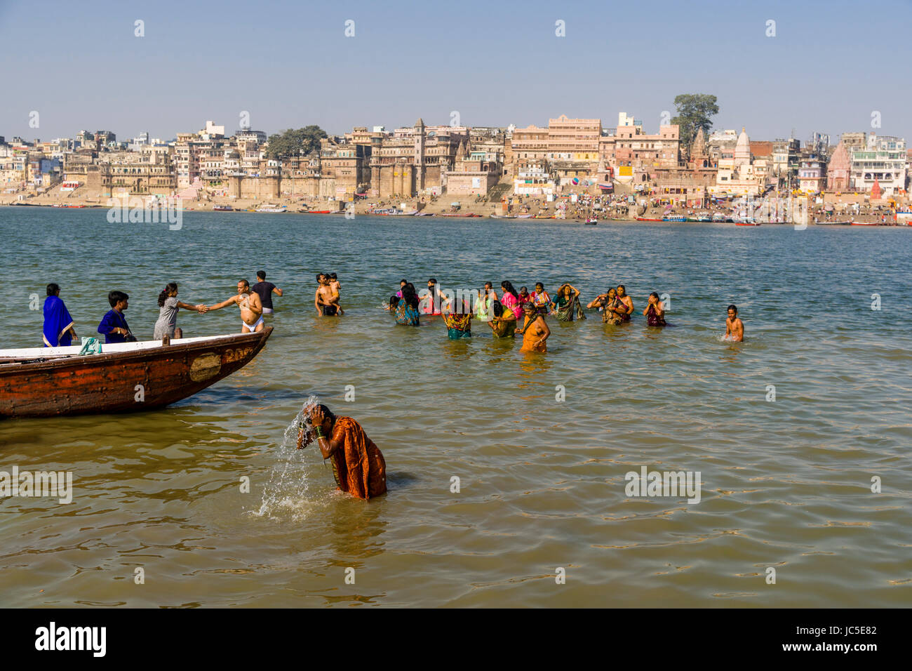 Pilgrims are taking bath and pray on the sand banks at the holy river ...