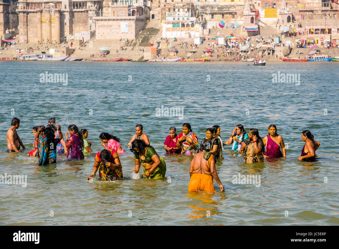 Pilgrims are taking bath and pray on the sand banks at the holy river ...