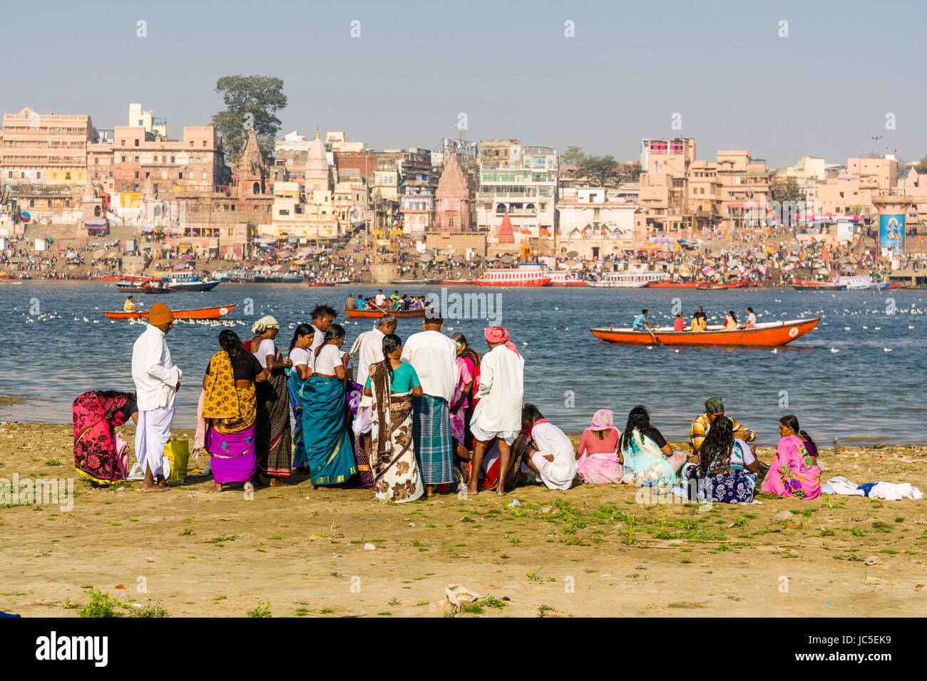 Pilgrims are gathering on the sand banks at the holy river Ganges ...
