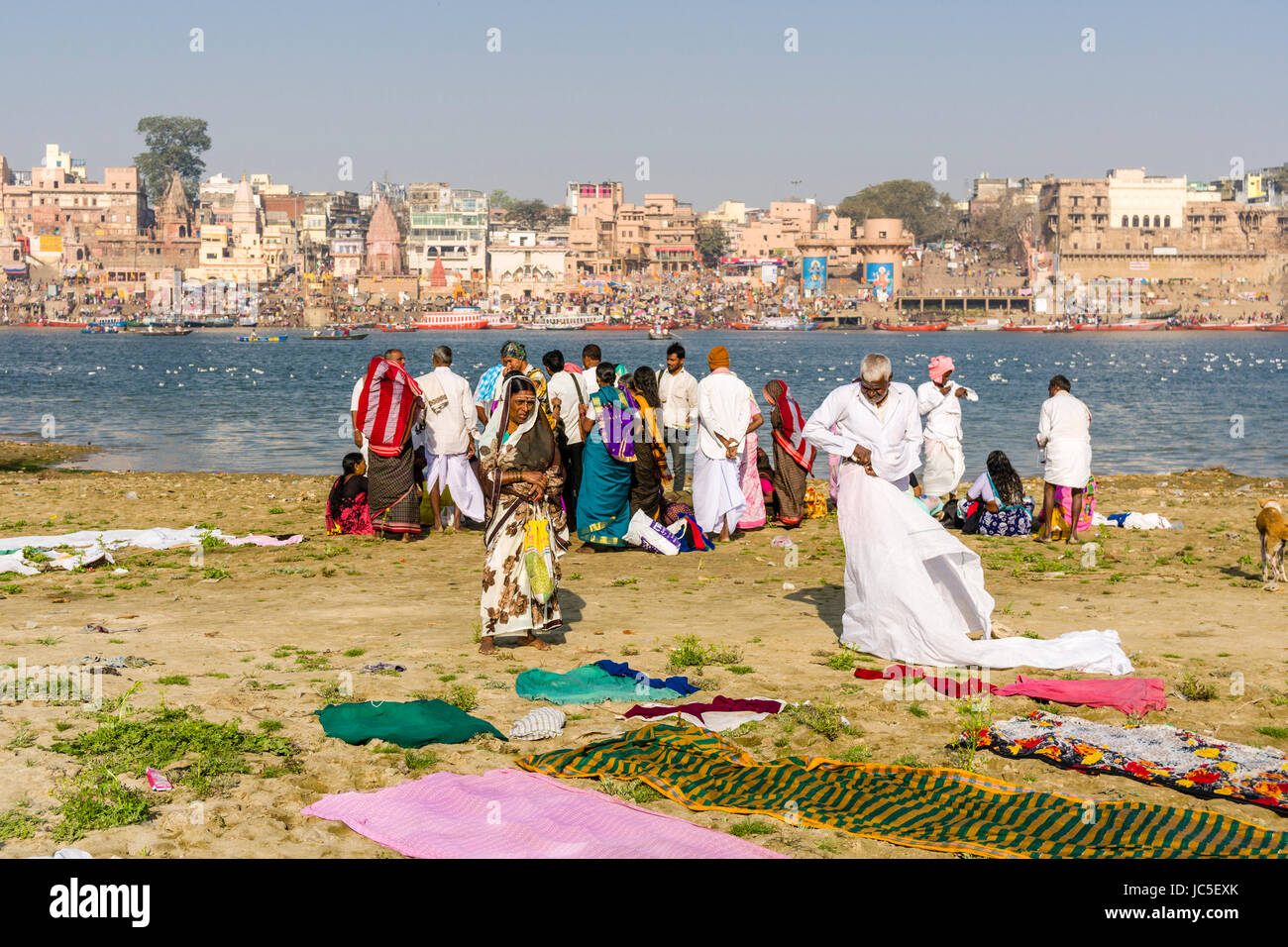 Pilgrims are gathering on the sand banks at the holy river Ganges ...