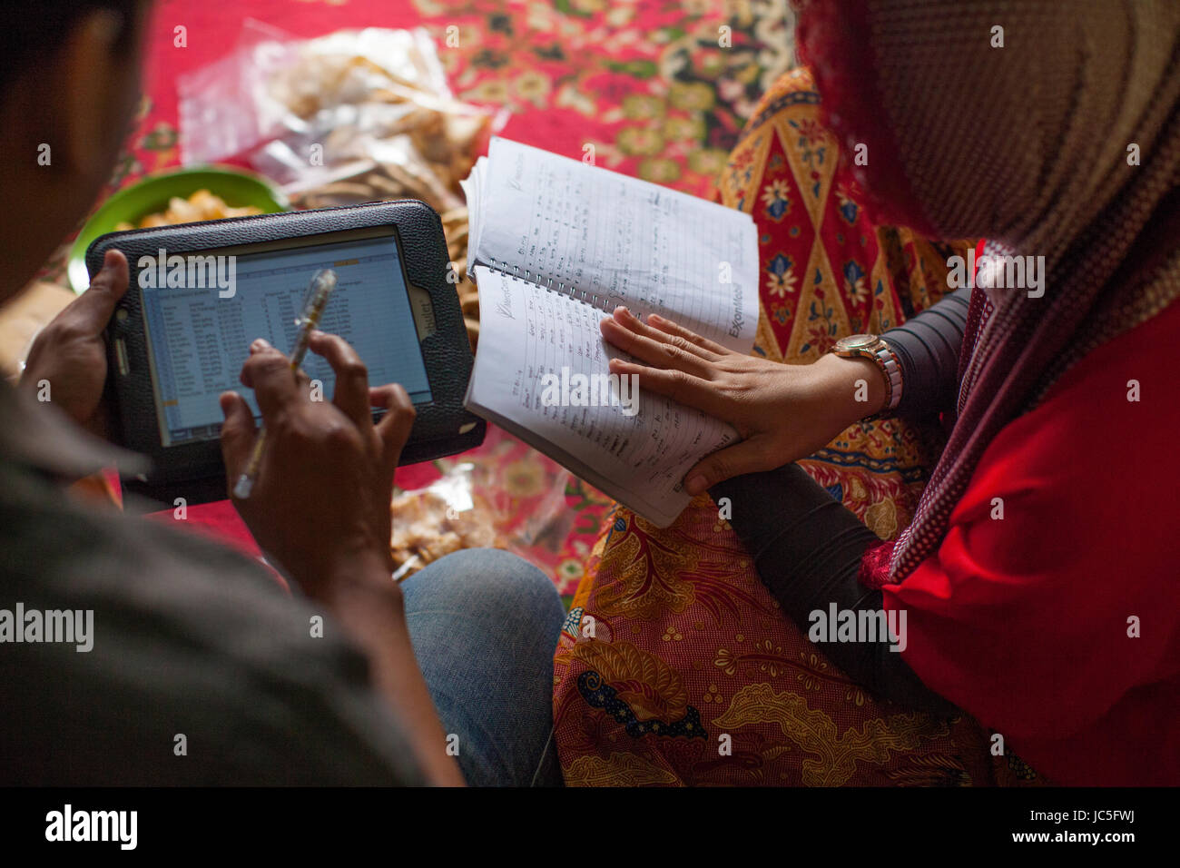 Business woman doing her book keeping, Indonesia, Asia Stock Photo - Alamy
