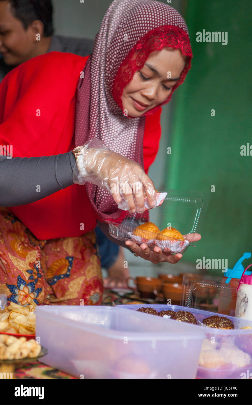 Female business woman packaging up the snacks she makes to sell ...