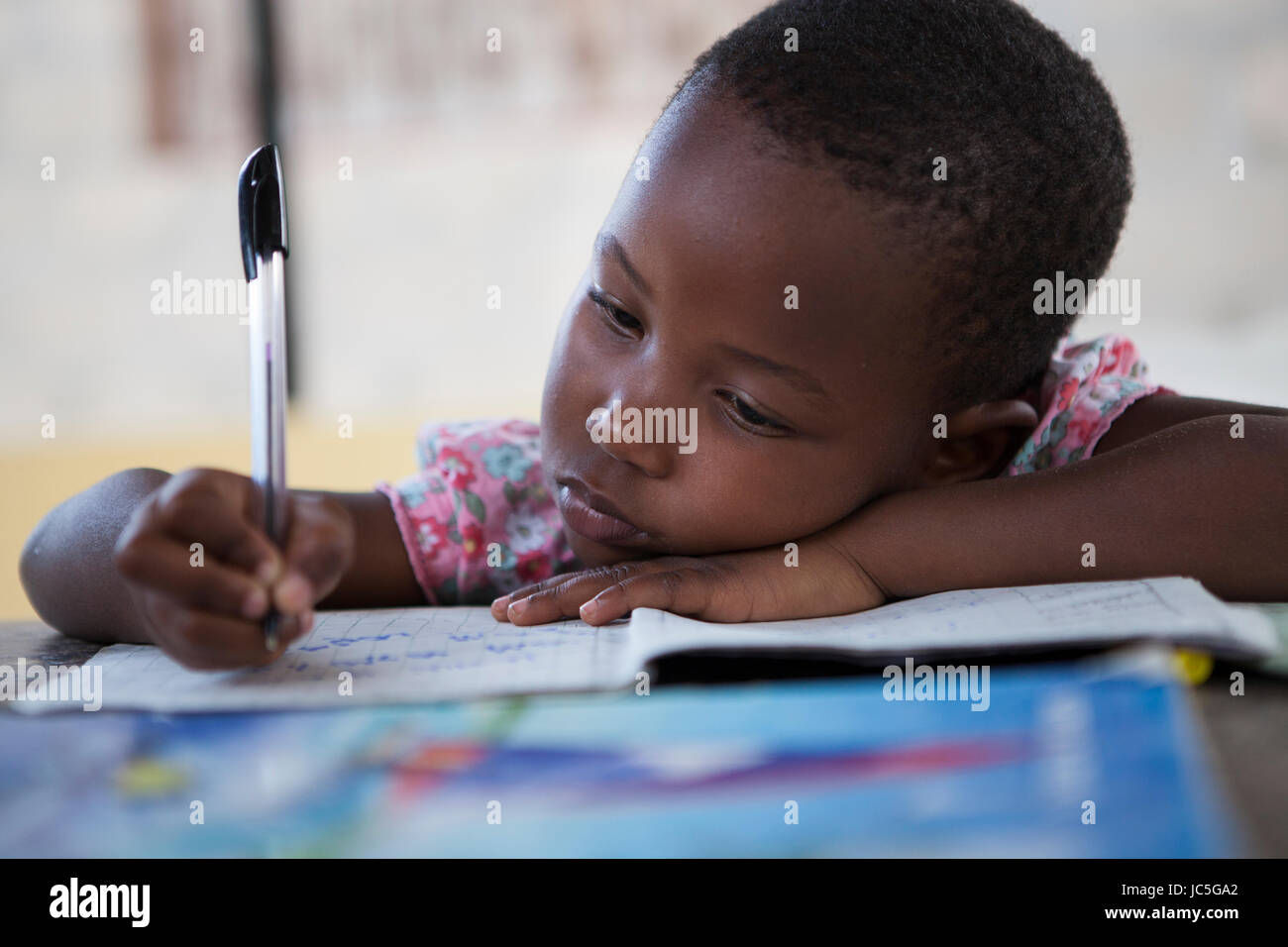 A young girl doing her homework, Tanzania, Africa Stock Photo - Alamy