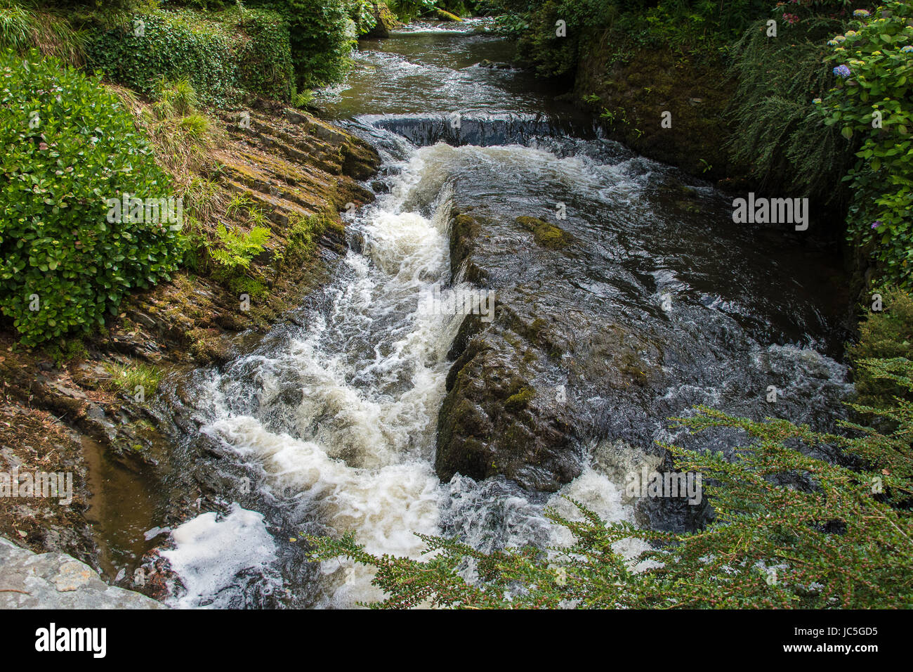 Water cascading over rocks in a river after heavy rainfall Stock Photo ...