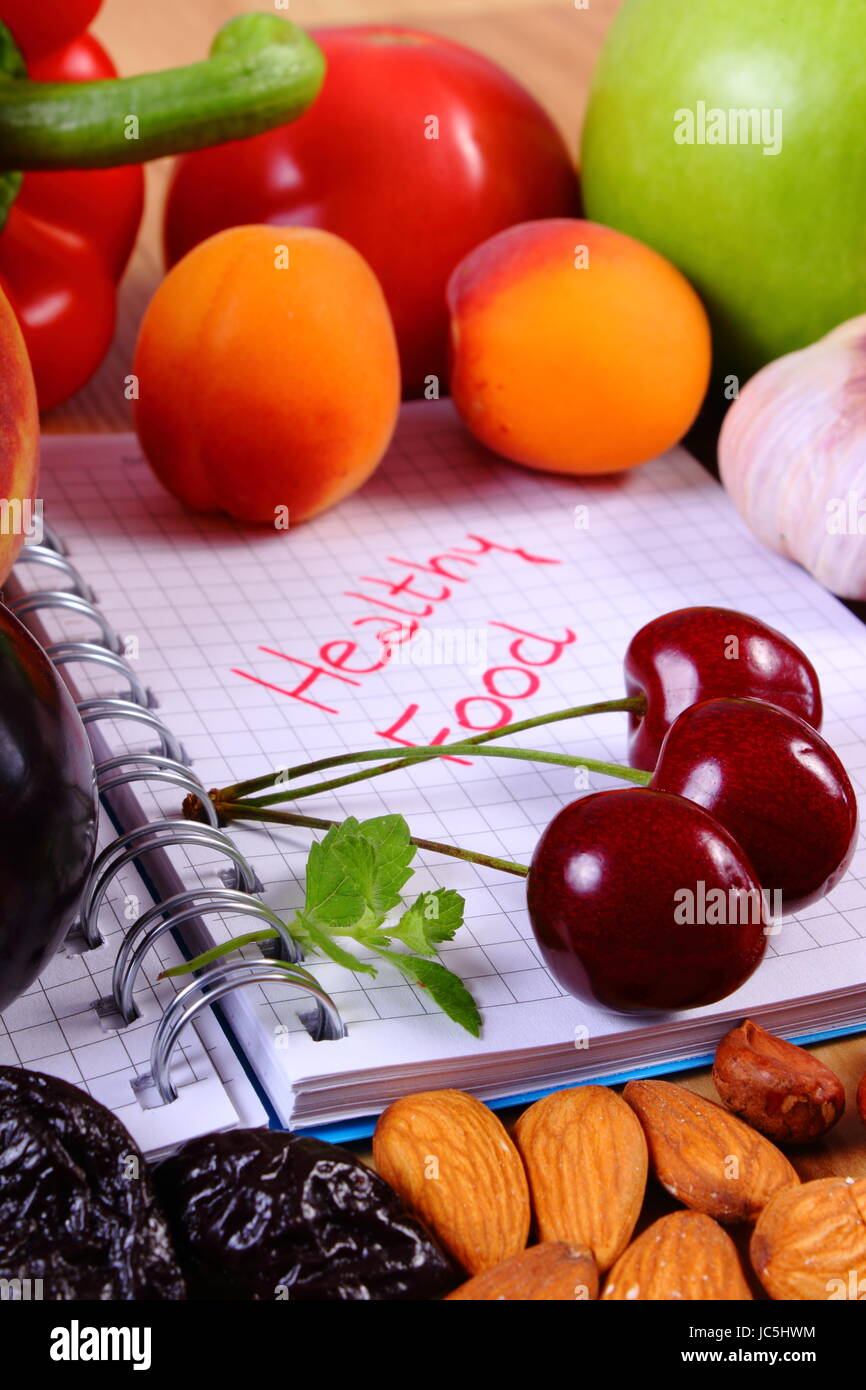Fresh fruits and vegetables with notebook for writing notes, concept of ...