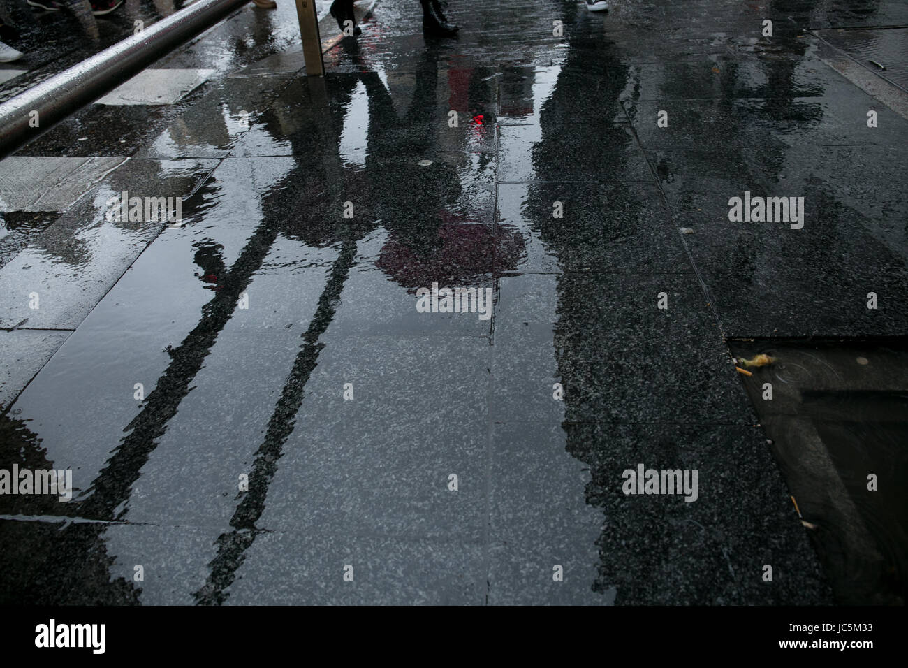 Shadows of people reflected in a rainy floor Stock Photo - Alamy