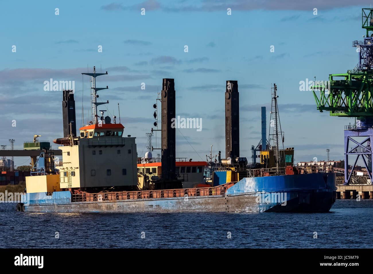Blue cargo ship in the port of Riga, Europe Stock Photo - Alamy