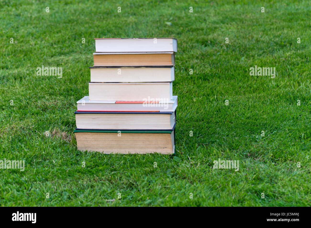 book on the grass Stock Photo - Alamy
