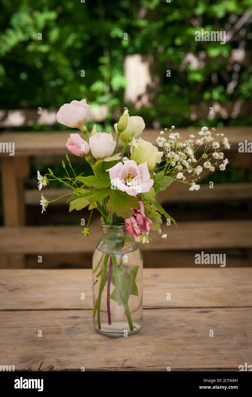 Glass jar of flowers Stock Photo - Alamy