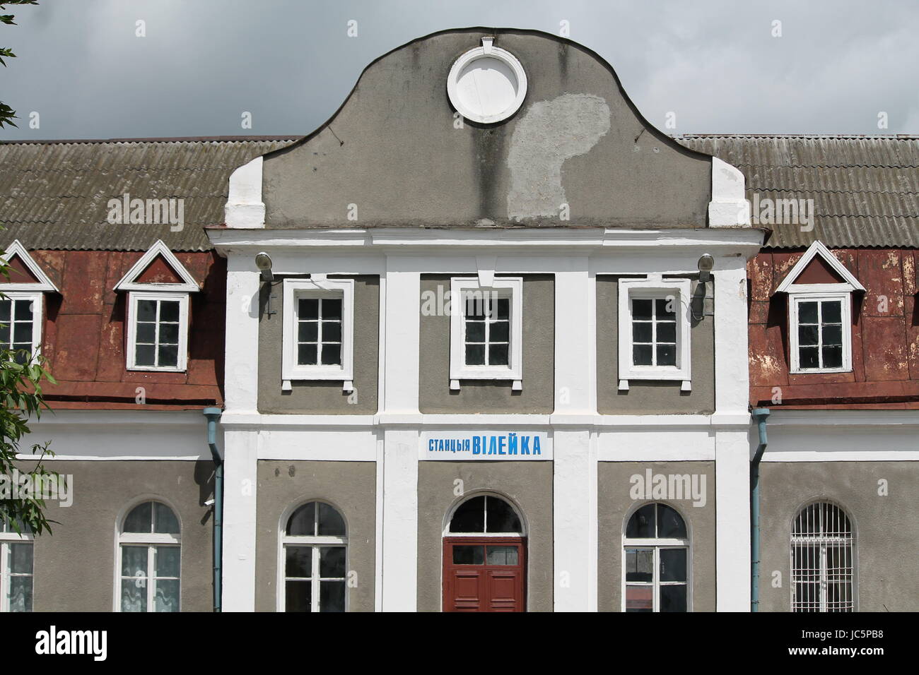 building of railway station in retro style with narrow windows and arch ...