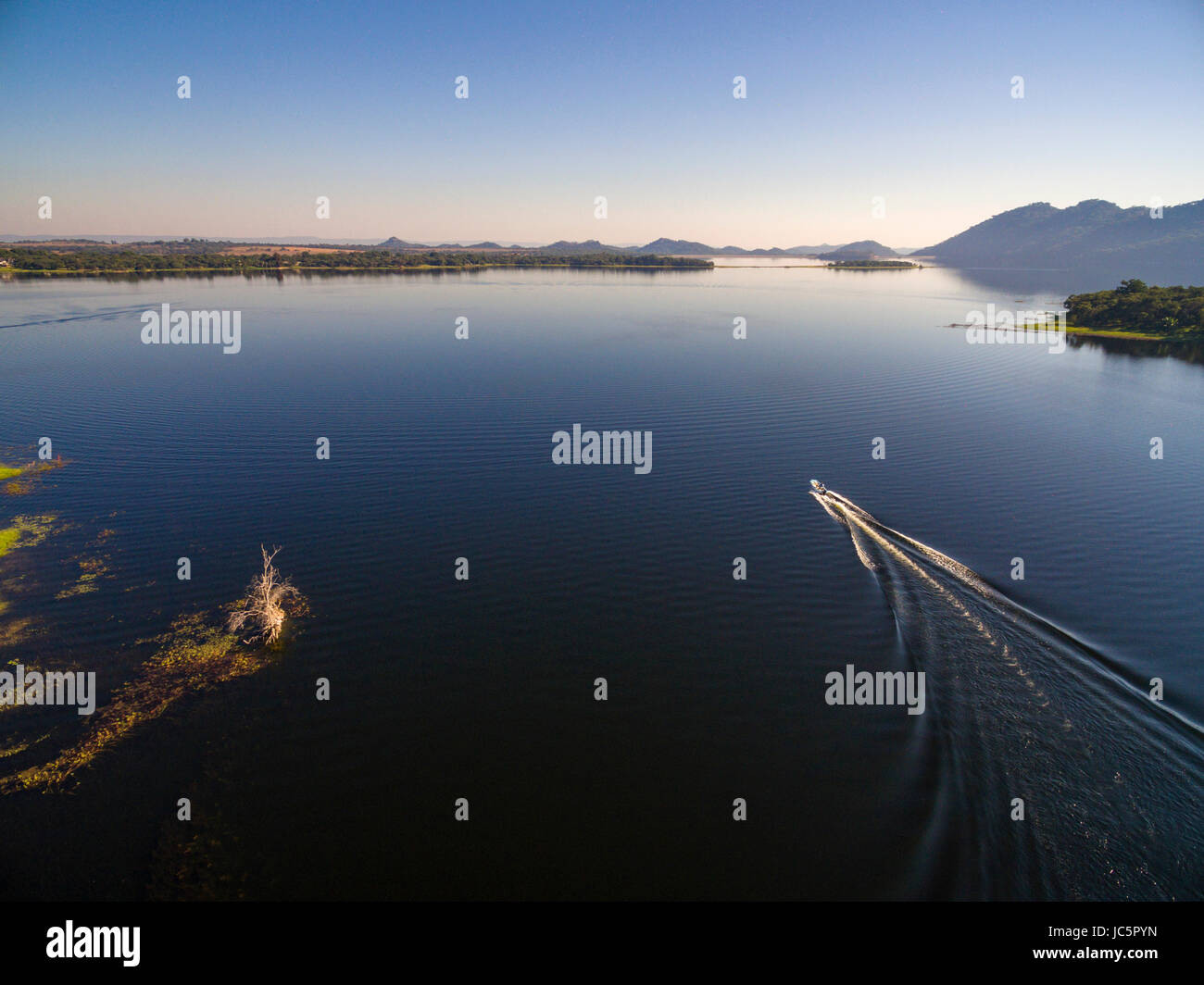 A speedboat seen at Mazvikadei dam in Zimbabwe Stock Photo - Alamy