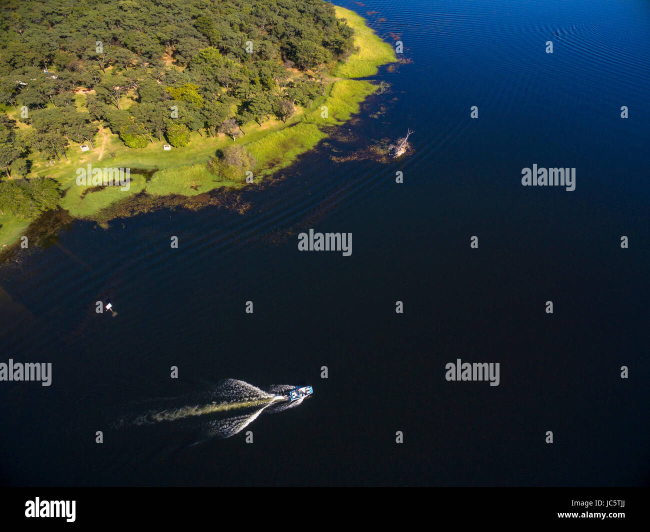 A speedboat seen at Mazvikadei dam in Zimbabwe Stock Photo - Alamy