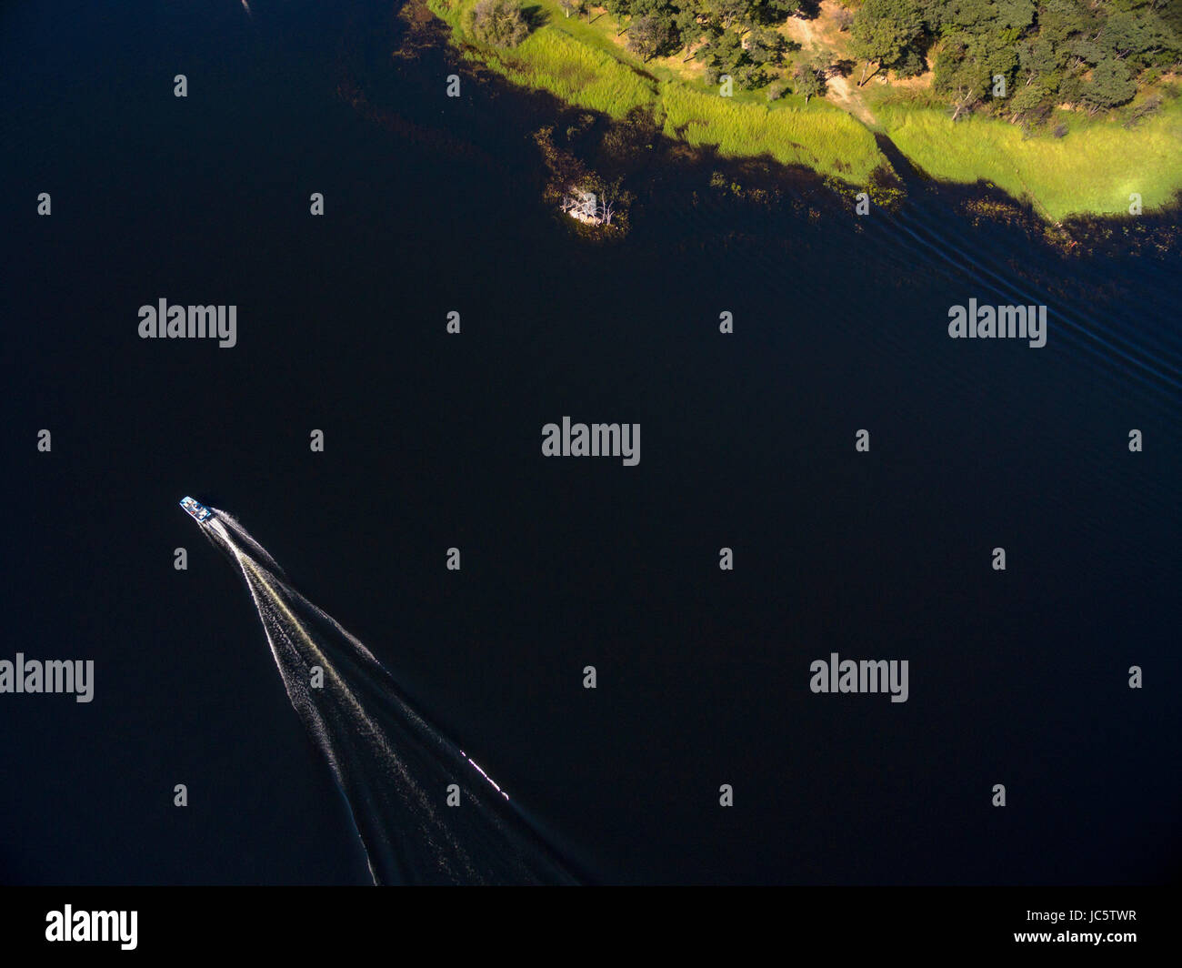 A speedboat seen at Mazvikadei dam in Zimbabwe Stock Photo - Alamy