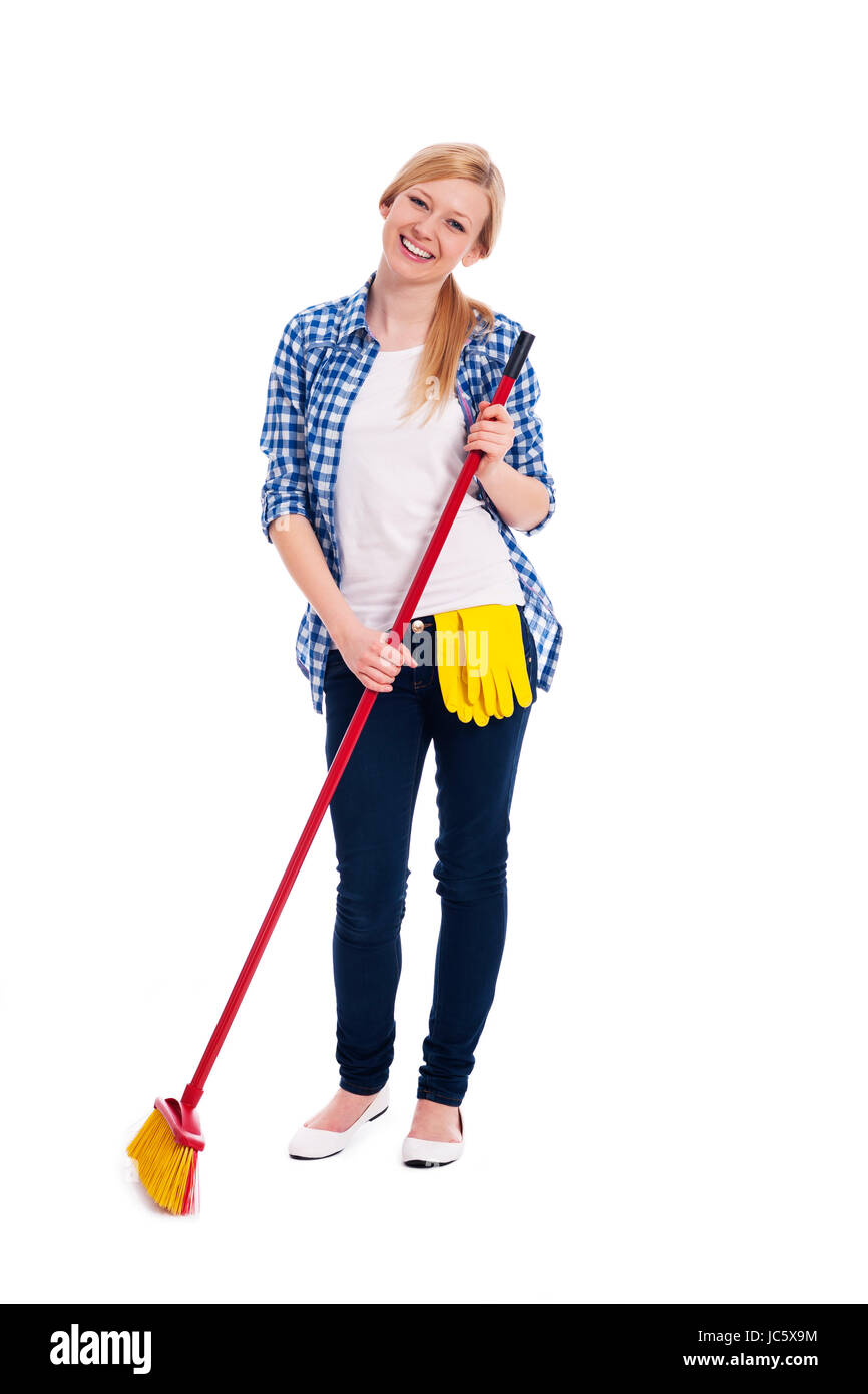 Beautiful and smiling woman sweeping the floor Stock Photo - Alamy