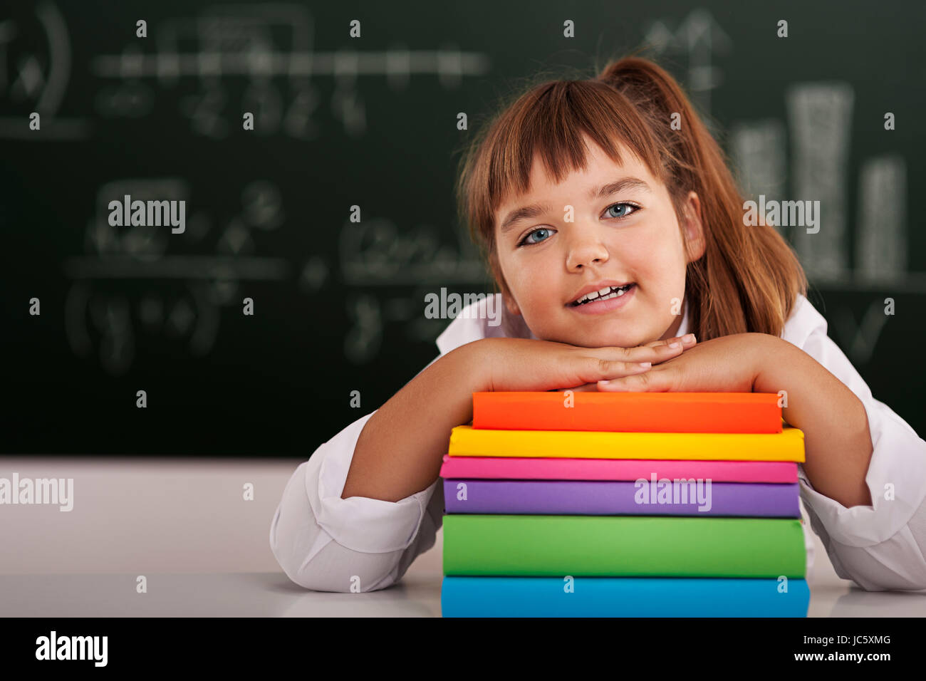 Cute little girl with her books Stock Photo - Alamy
