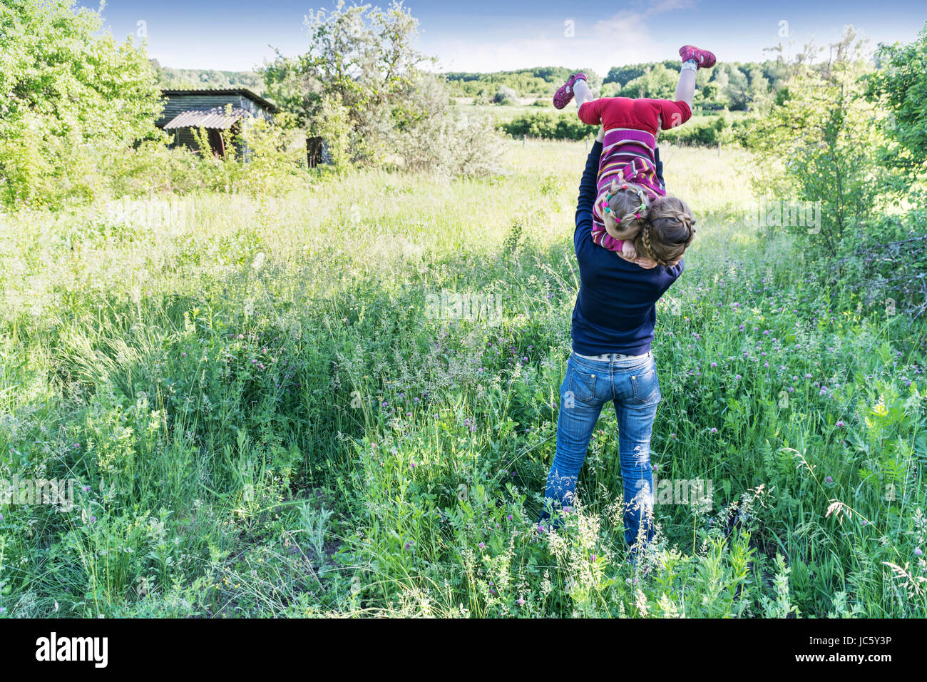 Mom throws her child Stock Photo - Alamy