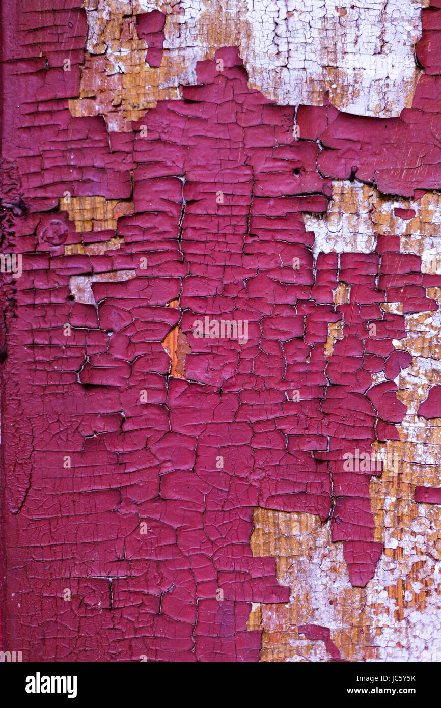 Cracked wall with old layers of paint in abandoned house. Background ...