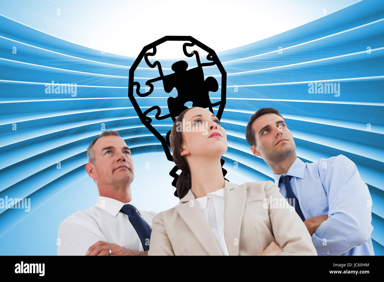 Composite image of serious work team posing together looking away Stock ...