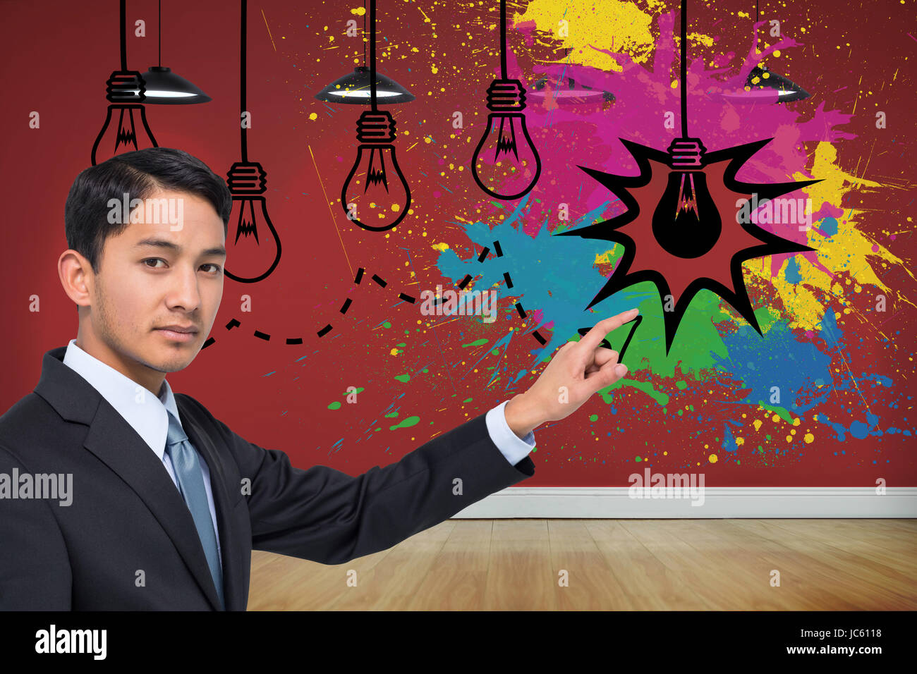 Composite image of stern asian businessman pointing Stock Photo - Alamy