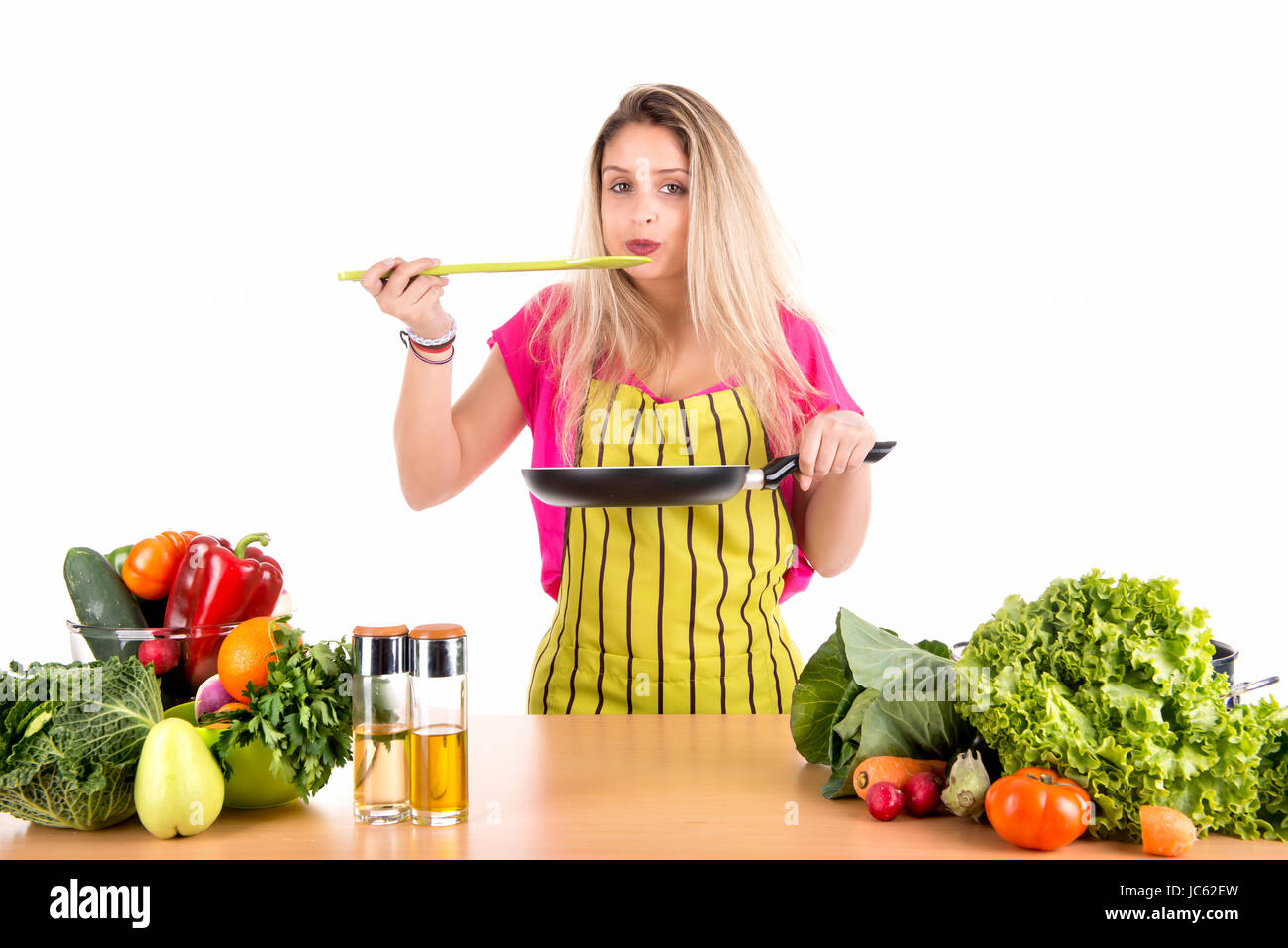 Beautiful woman cooking in the kitchen Stock Photo - Alamy