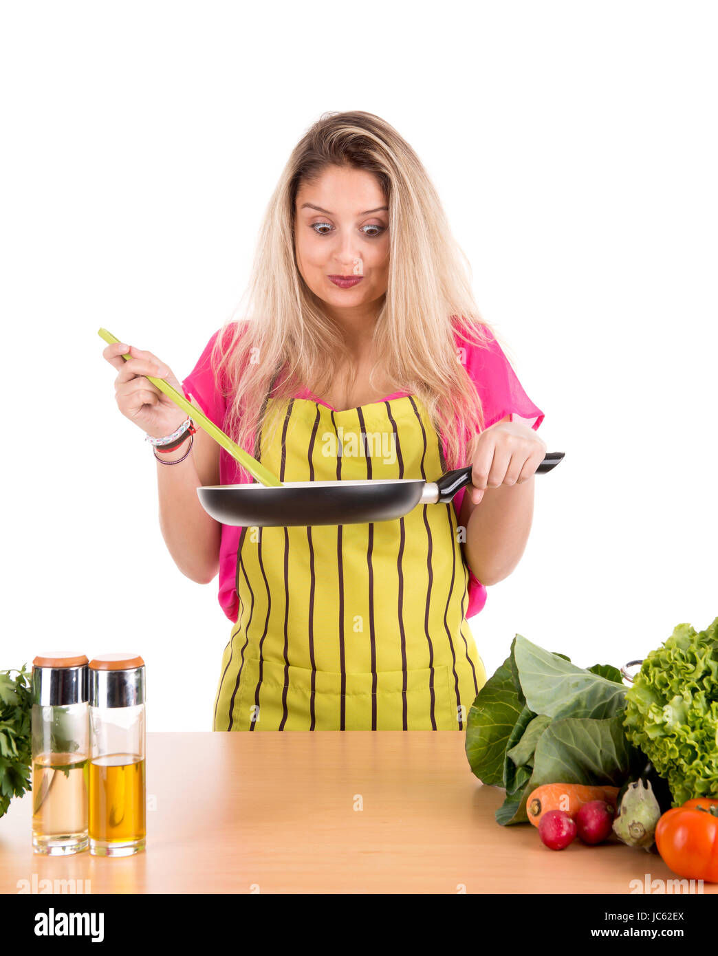 Beautiful woman cooking in the kitchen Stock Photo - Alamy