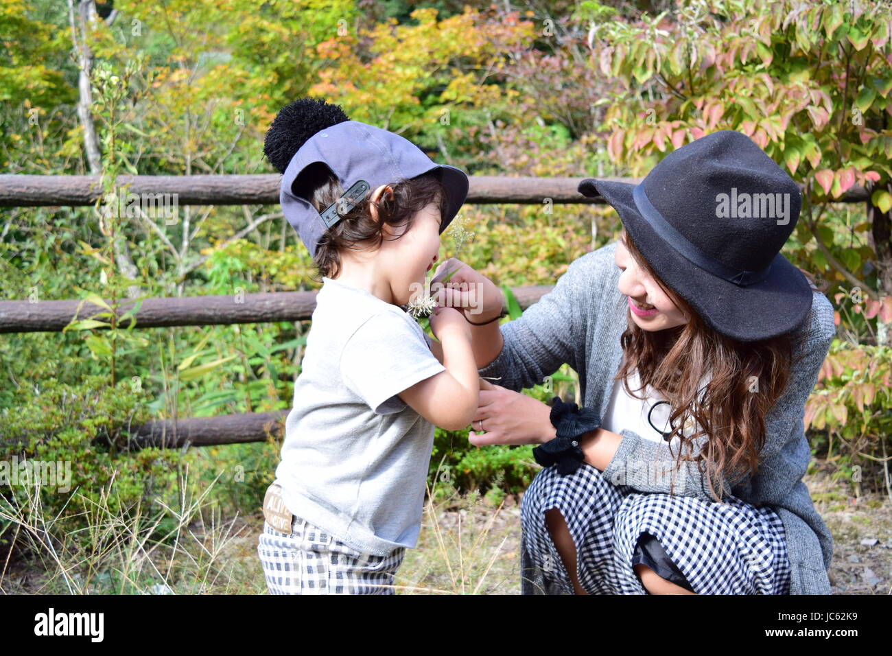 young japanese mother is playing with her son at outer place Stock Photo - Alamy