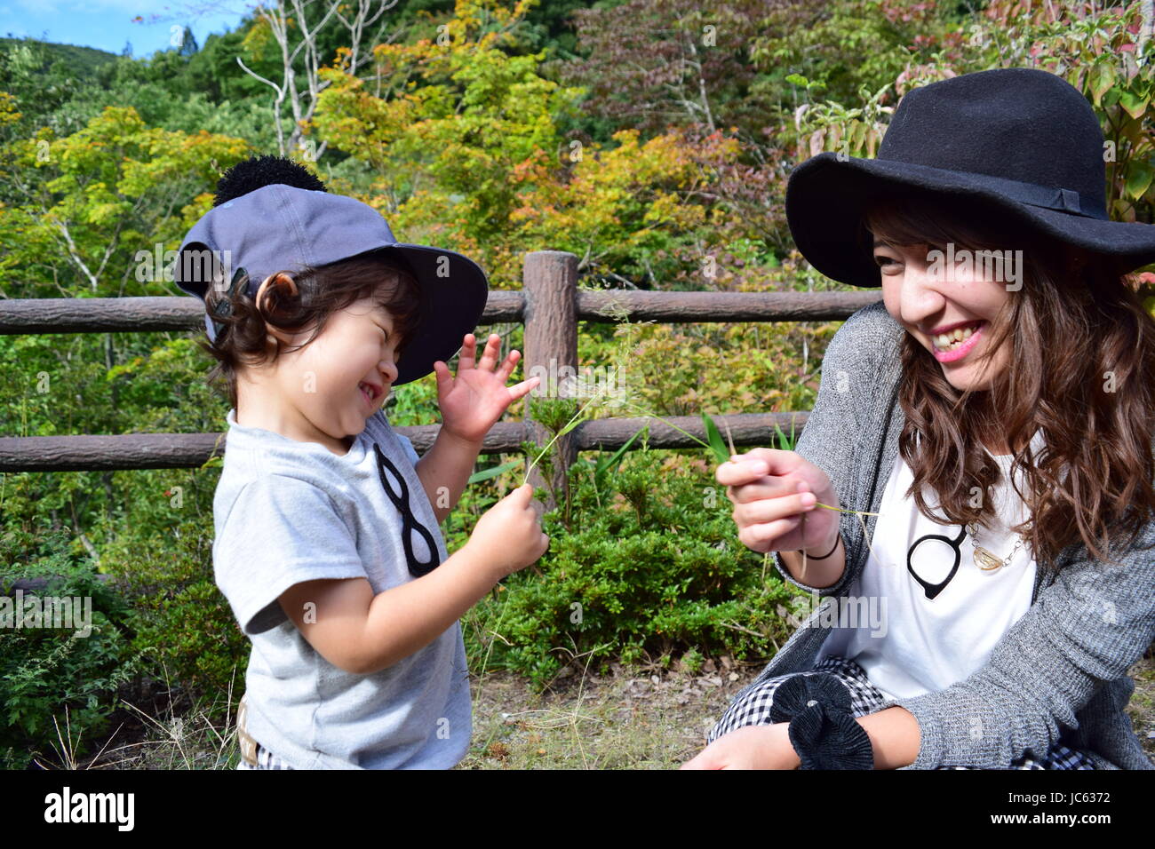 young japanese mother is playing with her son at outer place Stock Photo - Alamy