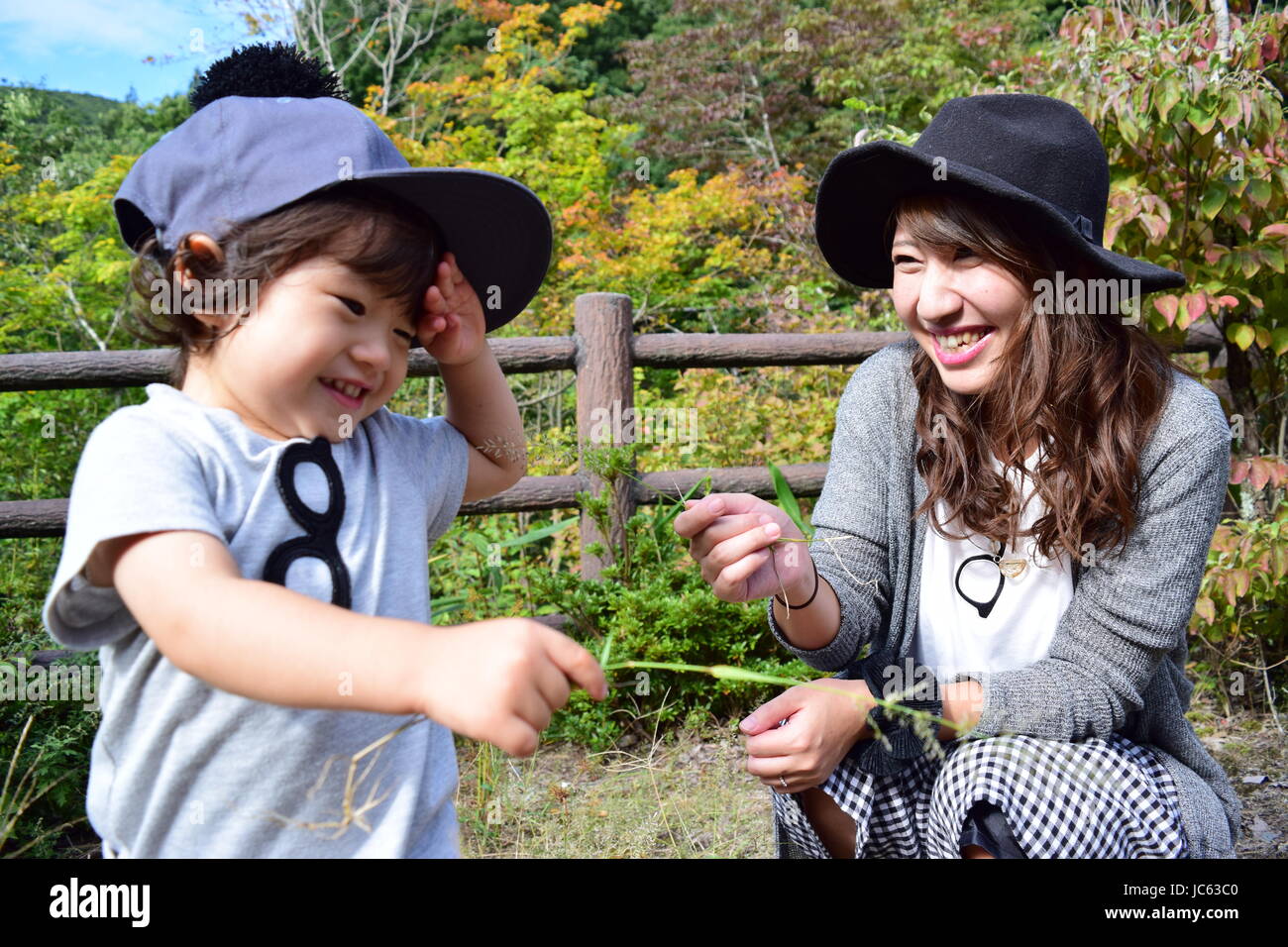 young japanese mother is playing with her son at outer place Stock Photo - Alamy