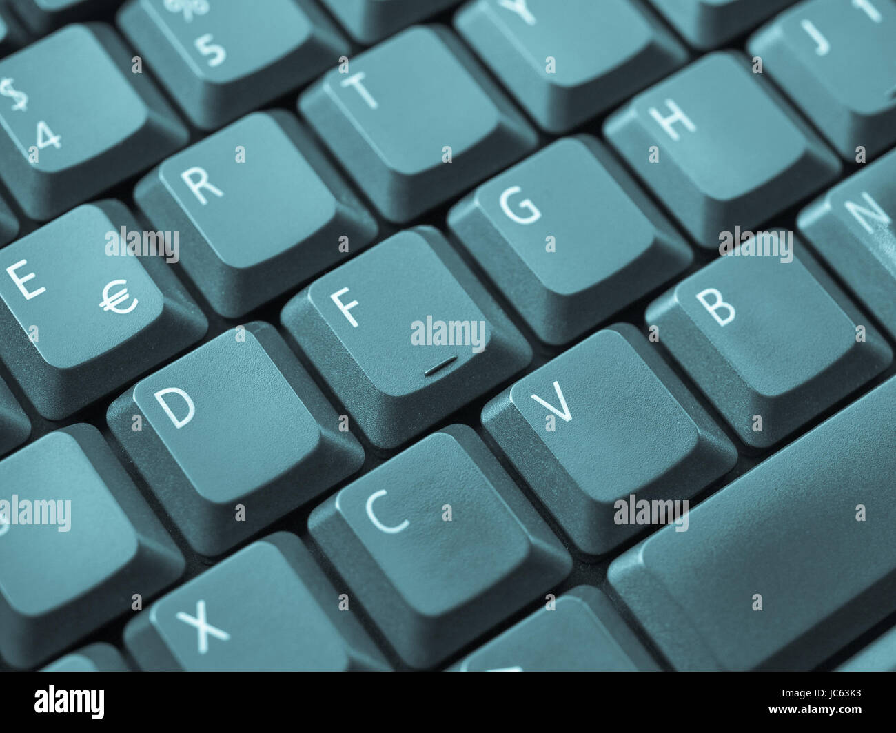 Detail of keys on a computer keyboard - cool cyanotype Stock Photo - Alamy