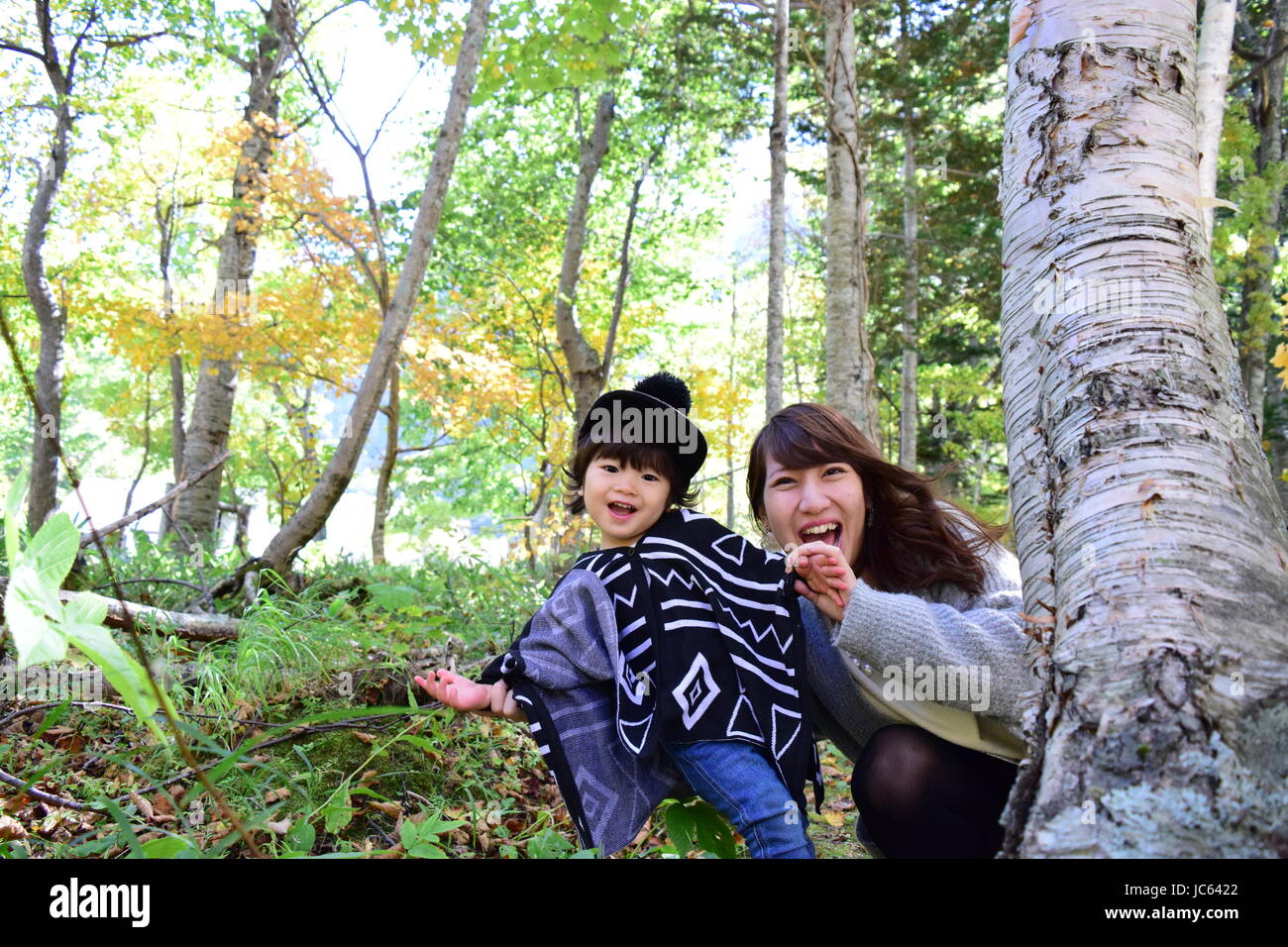 young japanese mother is playing with her son at outer place Stock Photo - Alamy