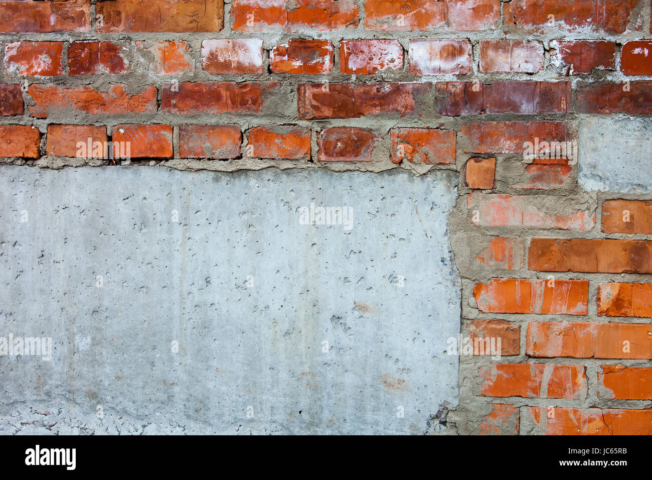 Brick wall with parts of concrete blocks Stock Photo - Alamy