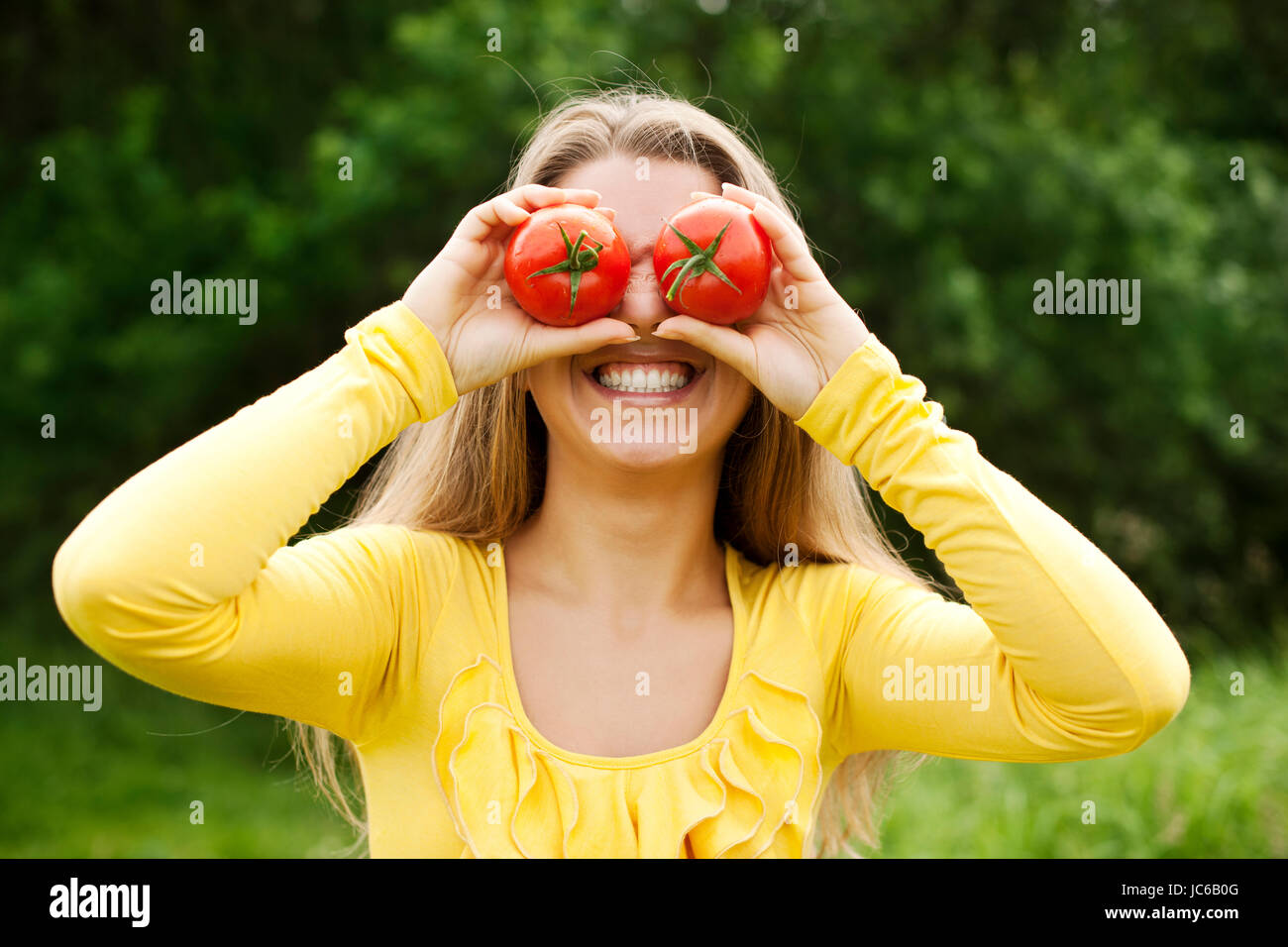 Fooling around with tomatoes Stock Photo - Alamy
