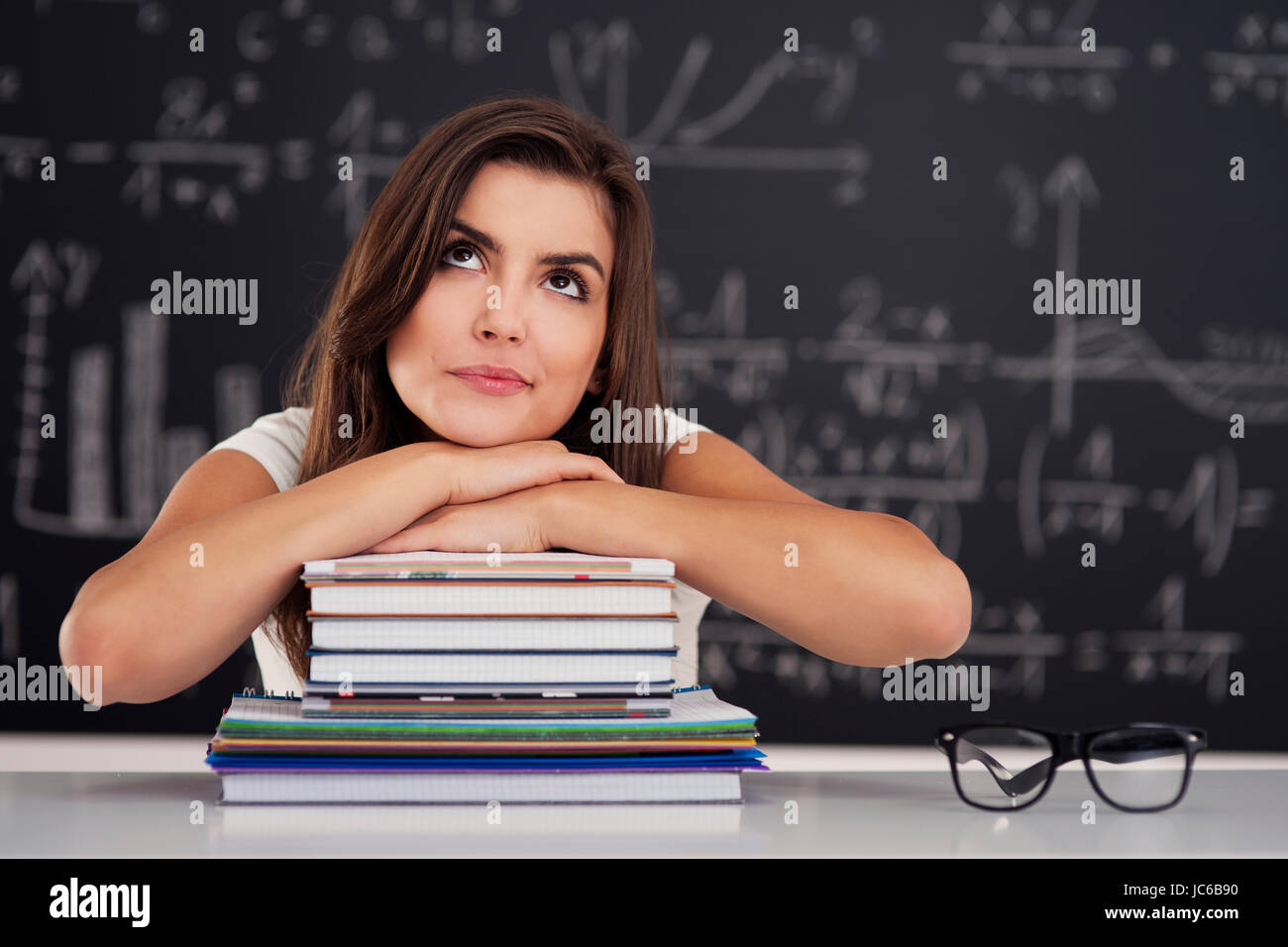 Dreaming female student portrait Stock Photo - Alamy